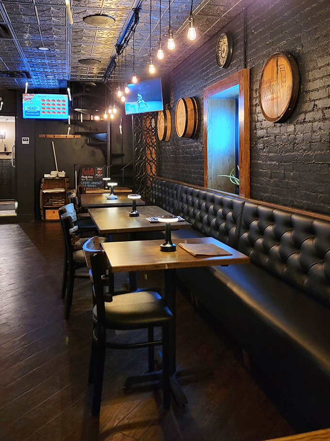 Leather booths and barrel accents create dining nooks that feel both exclusive and welcoming&mdash;the restaurant equivalent of a firm handshake.
