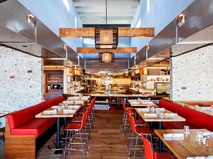 Red banquettes and wooden tables create a dining room that balances nautical heritage with modern California design&mdash;comfortable yet sophisticated enough for a special occasion.
