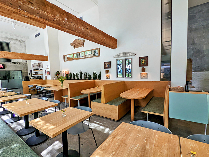 Wooden booths bathed in natural light create dining nooks that feel both communal and intimate&mdash;the restaurant equivalent of a perfect hug.
