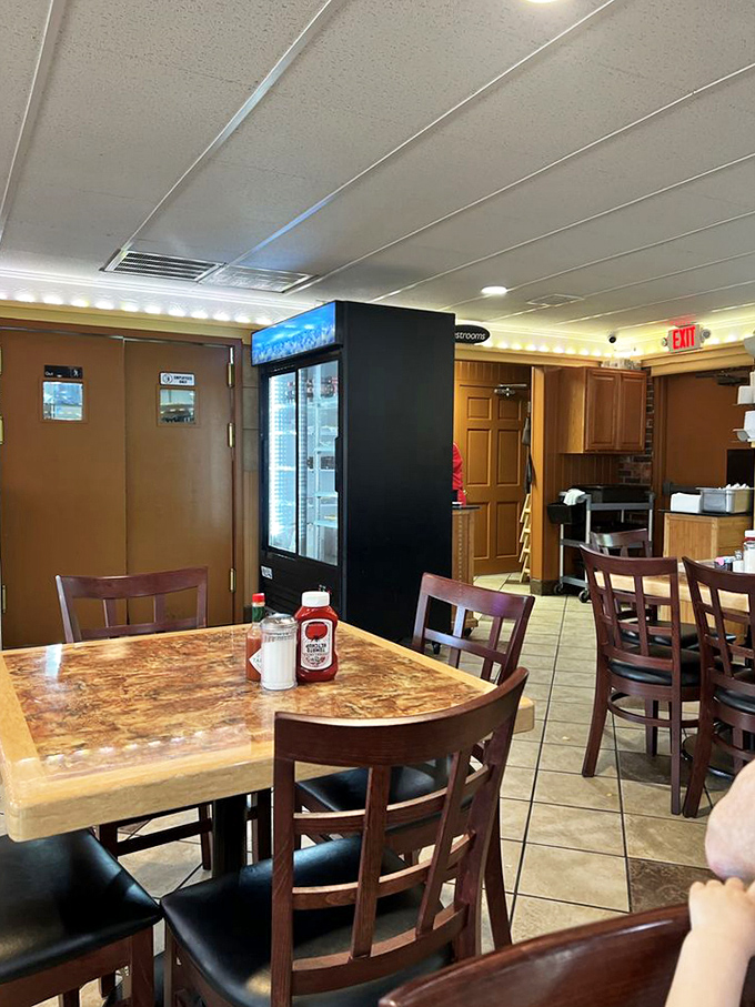 Classic diner simplicity: ketchup and salt shakers standing at attention, ready to enhance whatever comfort food lands on your table.