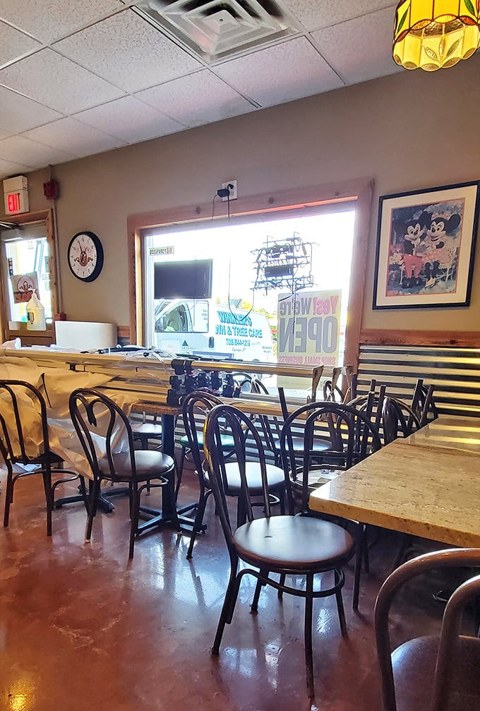 Simple seating with a view to the street&mdash;because when the food is this good, who needs fancy chairs or Instagram-worthy d&eacute;cor?