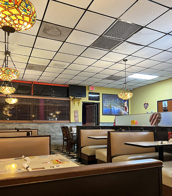 Tiffany lamps hanging like jewelry above booths that have witnessed first dates, breakups, and "let's split a slice" compromises.