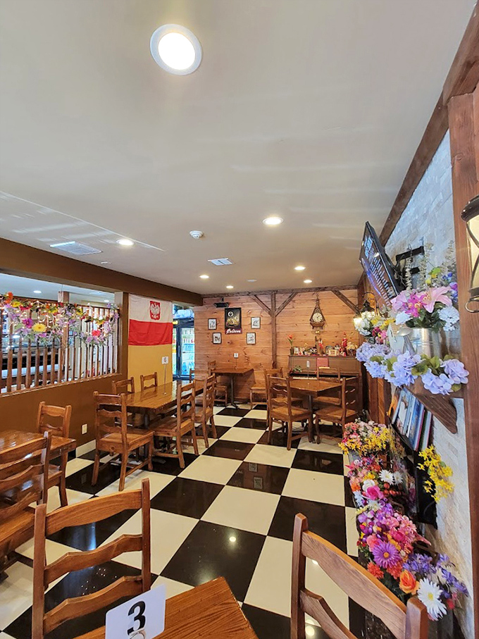 The dining room's checkerboard floor and wooden beams create an atmosphere that's both homey and special&mdash;like Sunday dinner at your favorite relative's.