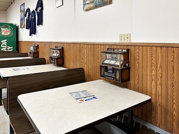 The booth seating area offers no distractions from the main event&mdash;just clean tables, wood paneling, and the promise of pizza perfection.
