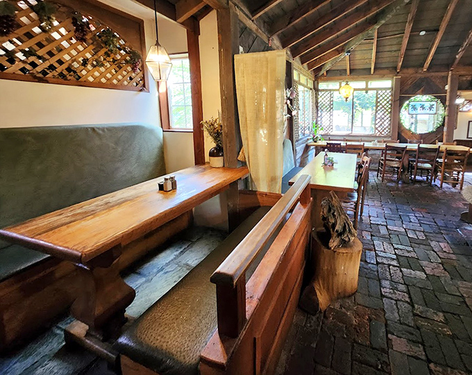Rustic bench seating and brick floors create dining spaces that feel both intimate and communal &ndash; like dinner at your most interesting friend's cabin.