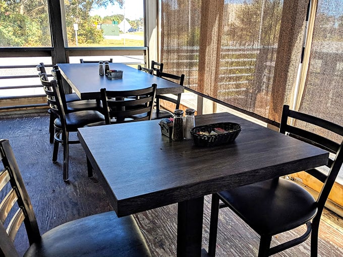 Simple tables by sun-filtered windows&mdash;because when the food is this good, you don't need fancy chairs or white tablecloths to feel special.