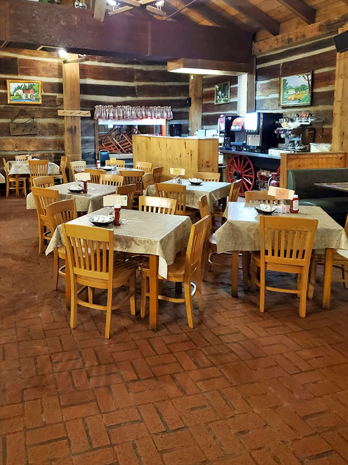 Simple wooden tables await your breakfast dreams&mdash;no pretension here, just honest surfaces ready for pancake perfection.