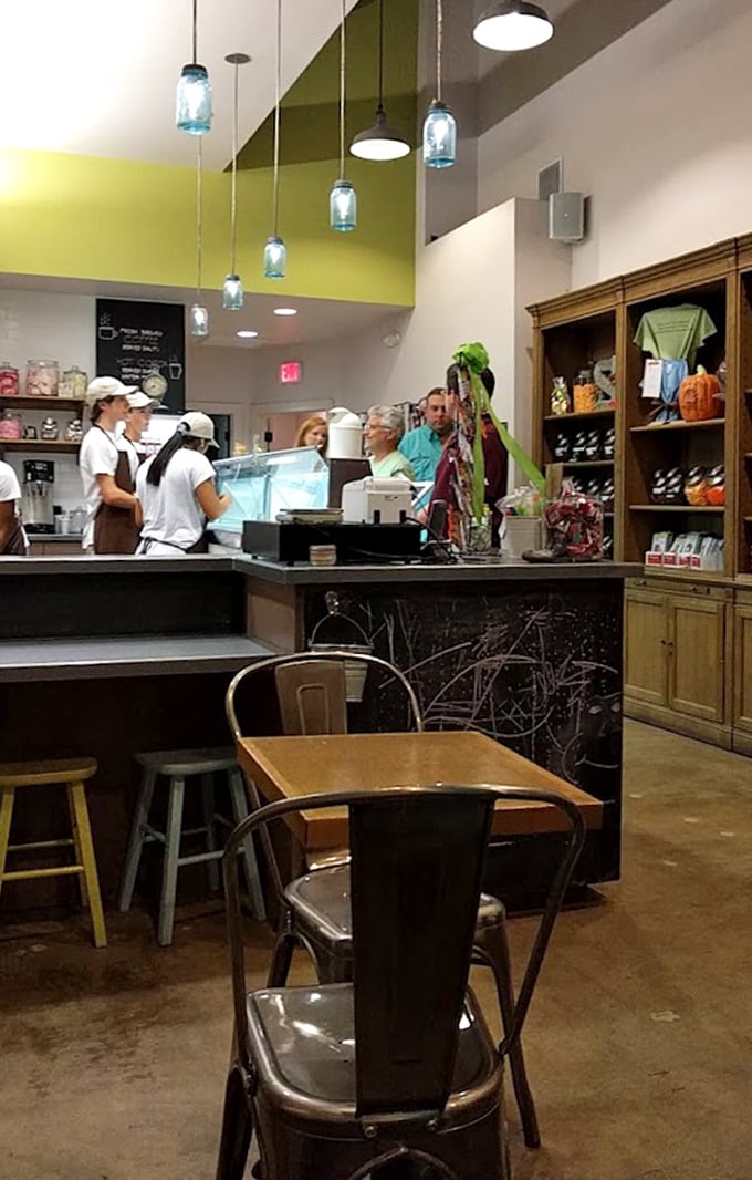 Modern rustic charm with blue mason jar lighting. The kind of thoughtful design that makes you want to linger long after your cone is gone.