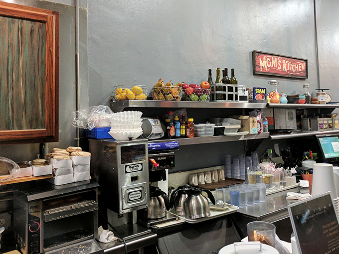 Fresh fruit baskets and coffee carafes stand ready for service&mdash;the building blocks of happiness arranged on stainless steel shelves.