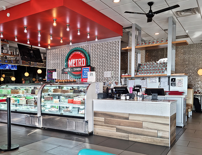 The pastry counter stands like the pearly gates to dessert heaven, with the Metro Cafe logo promising salvation from boring food.