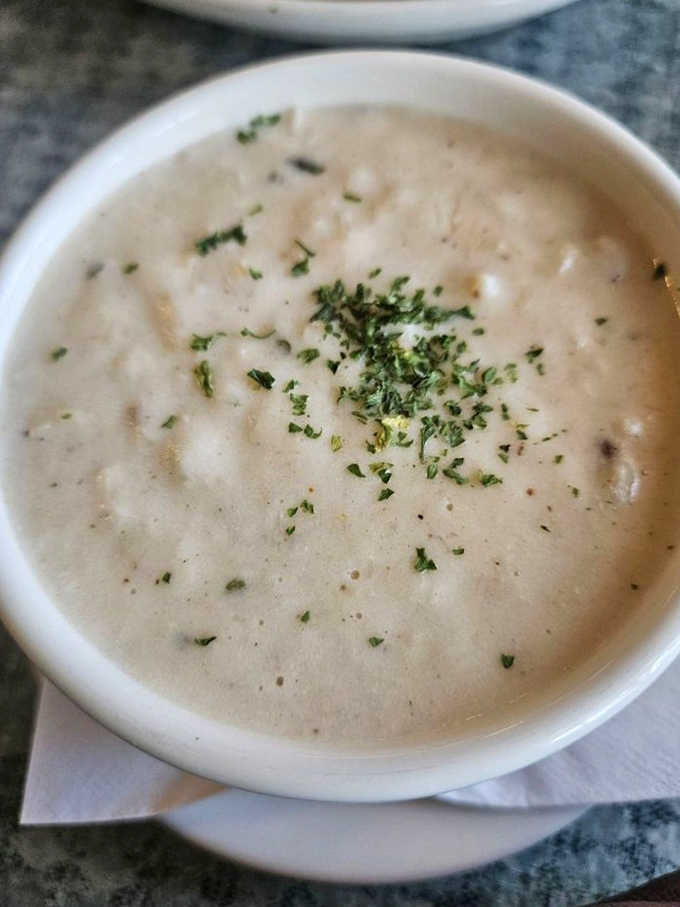 She-crab soup so velvety and rich, it should be classified as a liquid hug in a bowl, with each spoonful delivering coastal comfort.