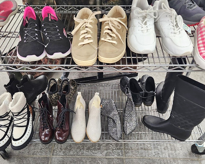 Shoes lined up like hopeful dancers at an audition. Those pristine white sneakers and vintage boots are ready for their second act on new feet.