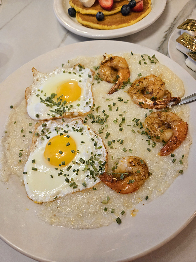 Shrimp and grits with sunny-side-up eggs&mdash;where Southern comfort meets Philadelphia hospitality on a single magnificent plate.