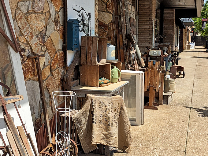 The treasure hunt continues outside! Architectural salvage and weathered wood pieces bask in the sunshine, tempting passersby.