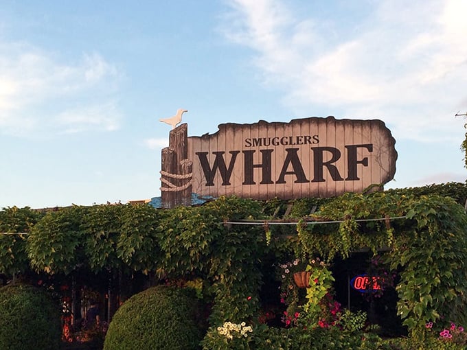 The weathered sign stands guard like an old salt, promising adventures in every bite below.