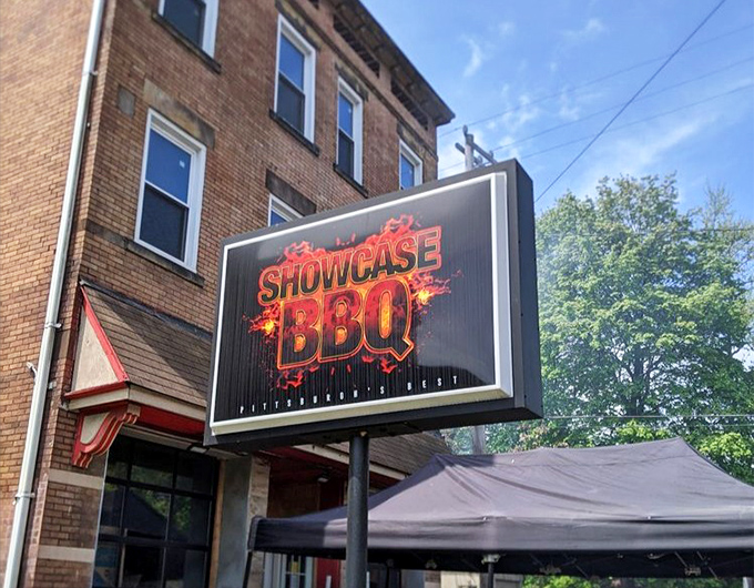 The sign glows like a beacon for barbecue pilgrims. In Pittsburgh's Homewood neighborhood, it's become a landmark for those seeking authentic flavor.