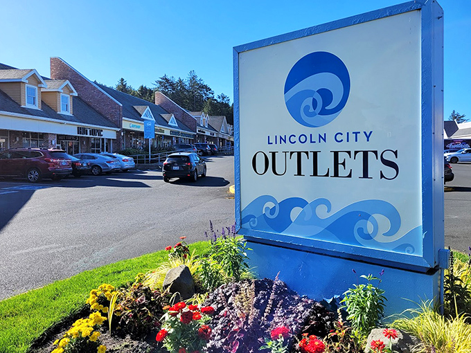 The iconic wave-inspired signage welcomes bargain hunters to their coastal shopping paradise, promising treasures within just steps from the Pacific.