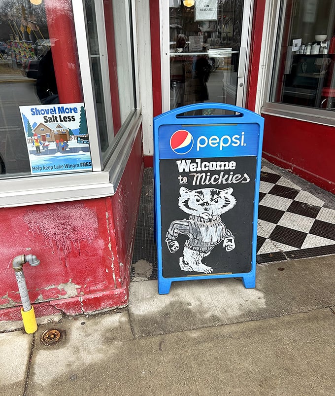 The welcoming Badger on Mickey's sign has been high-fiving hungry visitors for generations, promising satisfaction just steps away.