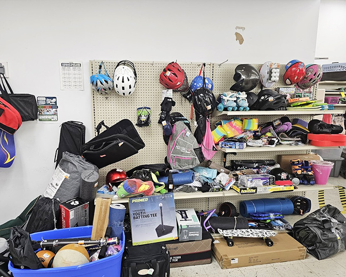 The sporting goods corner looks like the aftermath of a garage sale at the Olympic Village—equipment for every season and skill level.