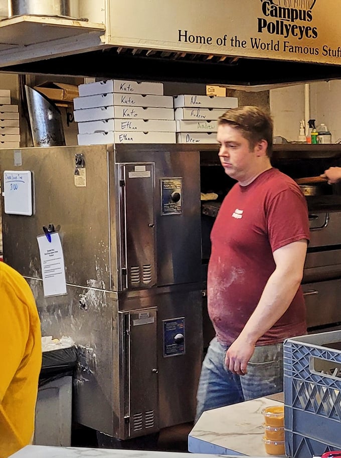Behind every great breadstick is a dedicated team. The kitchen staff works their doughy magic while covered in the badges of honor: flour and cheese.