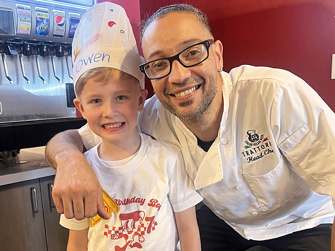 The chef's smile says it all &ndash; when you love what you do, it shows in every bite. Pizza-making isn't just a job, it's a calling.