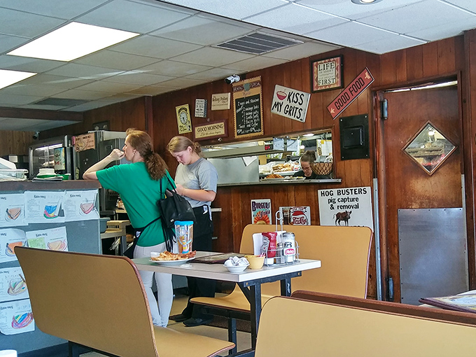 The bustling kitchen area where comfort food dreams come true, with staff working their magic behind the scenes.
