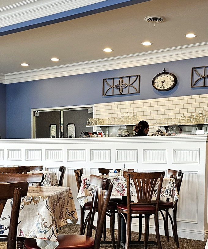 Behind that pristine white counter, breakfast magic happens. The subway tile backdrop adds a touch of modern to the classic space.