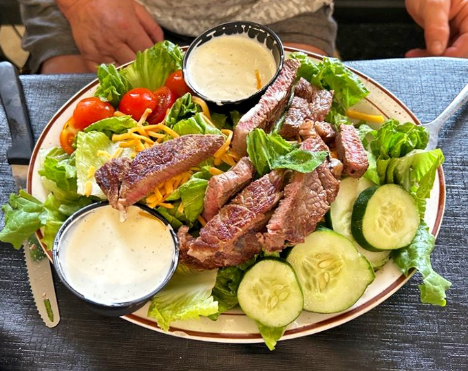 A steak salad that respects both your desire for protein and your halfhearted nod to vegetables. Those twin dressing cups are nature's perfect portion. 