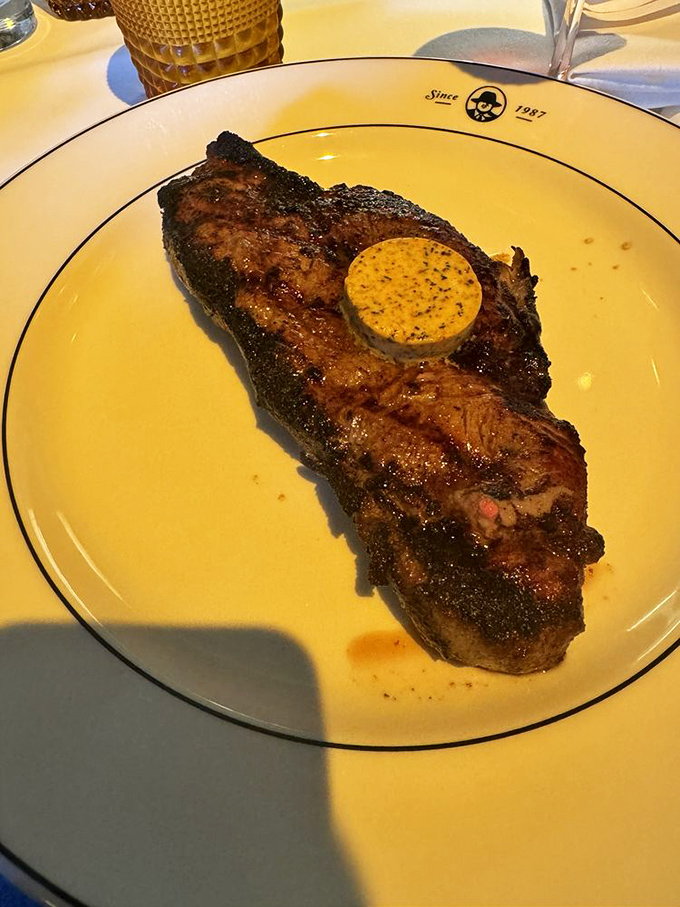 A perfectly seared New York strip with compound butter melting like a sunset &ndash; simple perfection that needs no elaborate explanation.