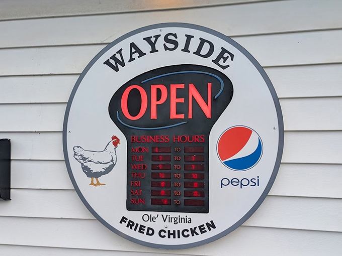 The hours sign featuring their chicken mascot tells you everything: this place is serious about poultry and has the confidence to prove it.