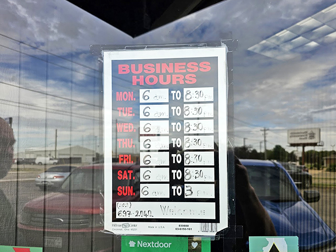 Business hours posted on the door reveal the diner's dedication to early risers and brunch enthusiasts alike, opening daily at 6 AM.