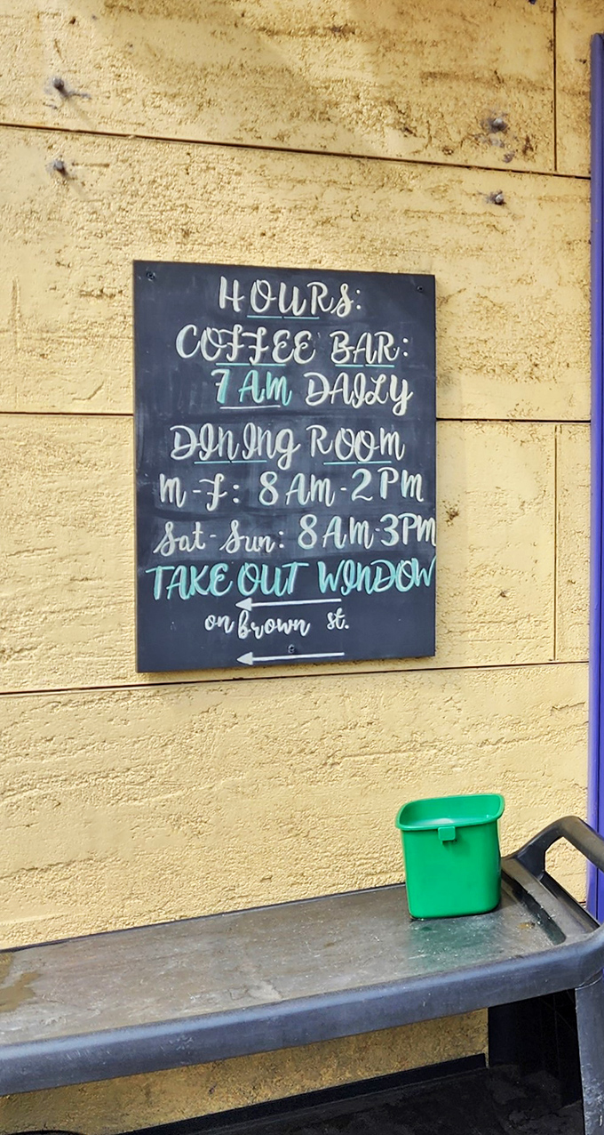 Hours posted with chalk and personality. The coffee bar opens at 7am because they understand morning emergencies require immediate caffeine.