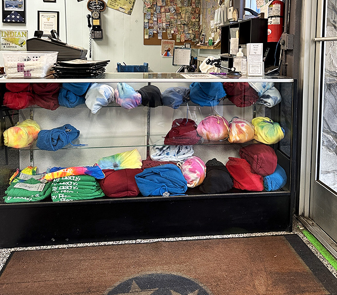 Tie-dyed shirts in the display case—because after these biscuits, you'll want to take the experience home with you.