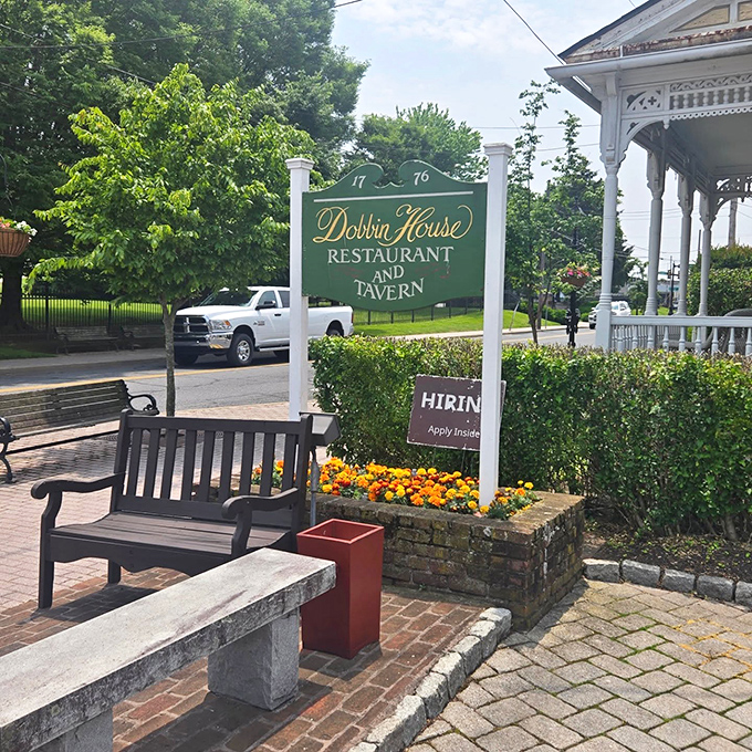 Summer greenery frames the iconic sign, proving that good taste never goes out of season in Gettysburg.