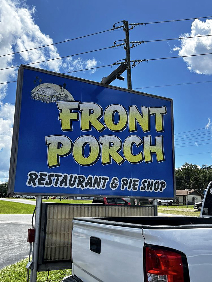 The blue and yellow sign proudly announces "Restaurant & Pie Shop"&mdash;two magical words that promise satisfaction against that perfect Florida sky.