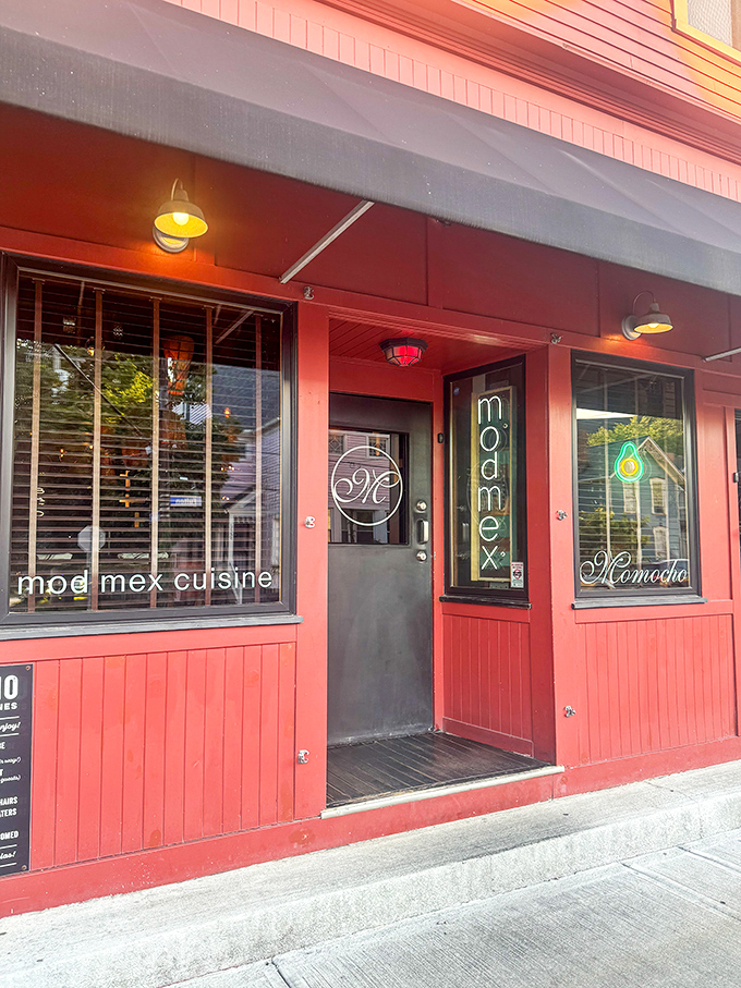 The storefront's vibrant red exterior and neon signage serve as a modern Mexican lighthouse guiding hungry souls to flavor salvation.
