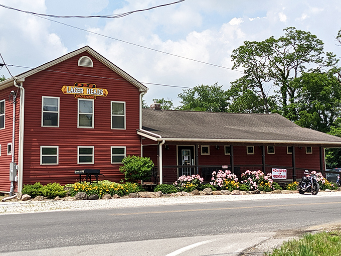 Summer blooms frame the entrance to this red-sided temple of smoke, nature's way of saying "good things inside."