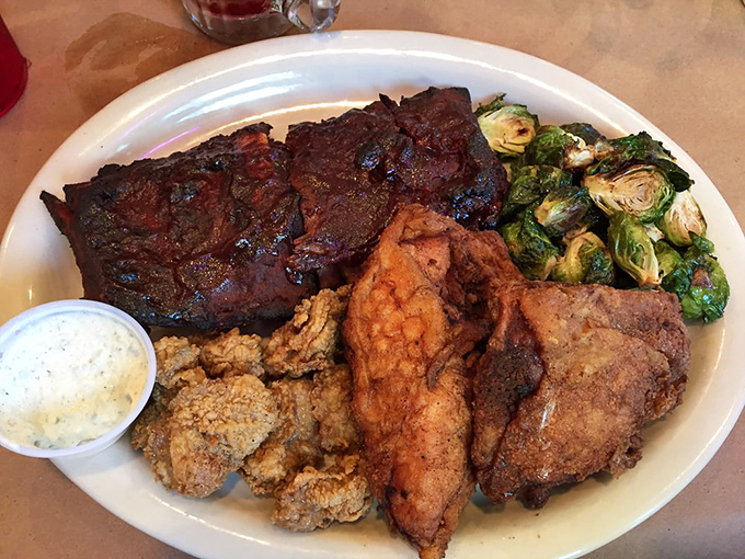 Land and sea call a delicious truce on this plate. Ribs, chicken, and fried seafood staging the most mouthwatering peace treaty in culinary diplomacy.