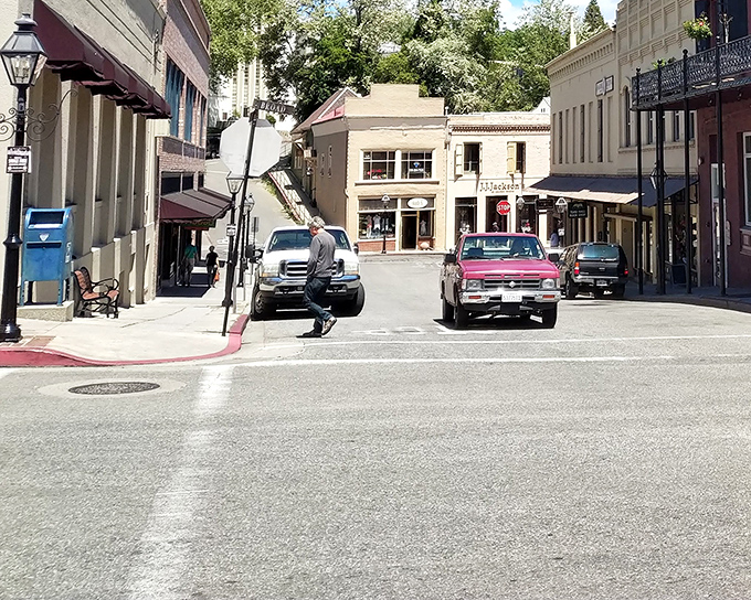 Pedestrians and pickup trucks share the narrow streets of downtown, where modern life moves at the relaxed pace of a bygone era.