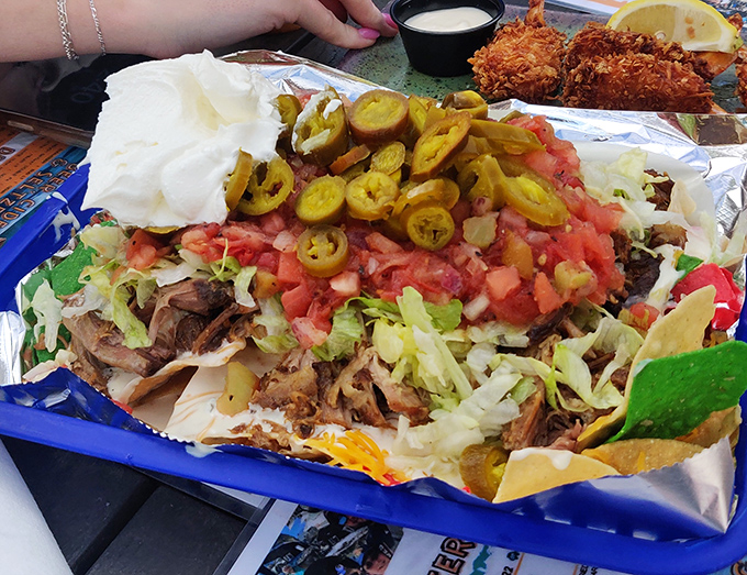 Nachos that require a strategy meeting before eating&mdash;where every chip is a delivery vehicle for pulled pork, jalape&ntilde;os, and enough cheese to make Wisconsin proud.