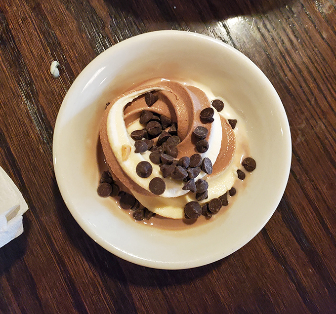 Chocolate and vanilla swirled soft serve topped with chocolate chips&mdash;simple, nostalgic, and exactly what your inner child ordered.