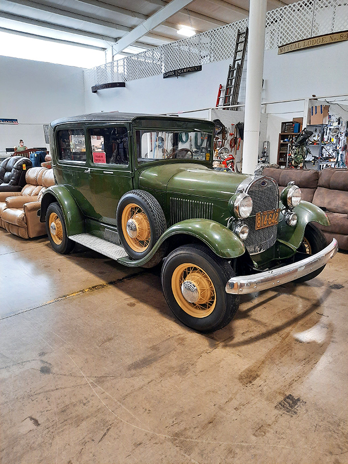 This isn't just a vintage car&mdash;it's automotive poetry in green. Those yellow-spoked wheels have stories to tell about country roads long forgotten. 