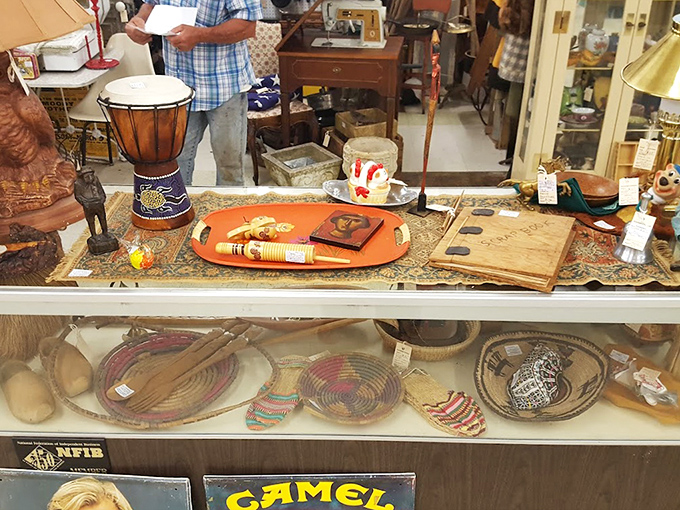 Artifacts arranged with museum-worthy precision behind glass. Those handcrafted baskets below might have carried picnic lunches to Pilot Mountain decades ago.