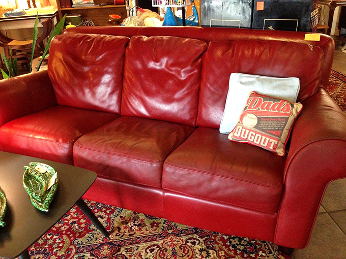 This rich leather sofa has already done the hard work of breaking in, offering comfort with character that no showroom couch can provide.