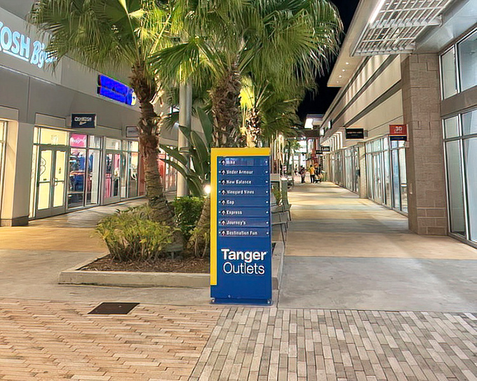 Evening lighting transforms these walkways into something almost romantic &ndash; if romance involves outlet pricing.