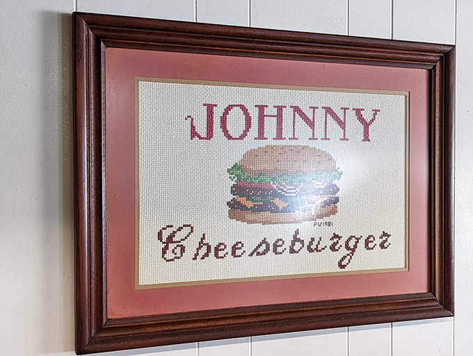 Cross-stitched burger art&mdash;because some masterpieces belong in frames, not museums. Grandma's hobby meets America's favorite food.