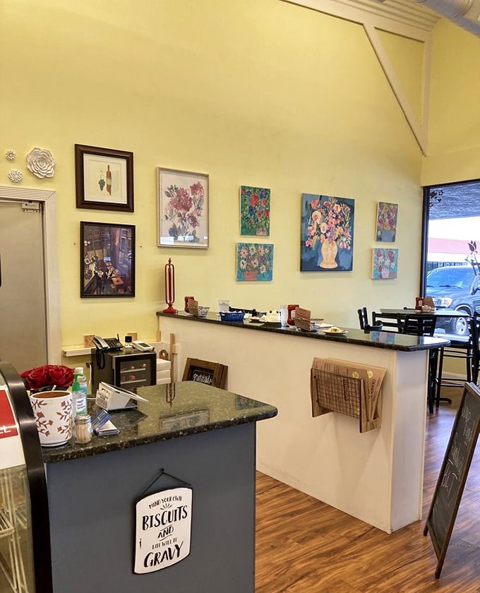 Floral artwork brightens yellow walls, creating a cheerful backdrop for serious eating. Dena's Place knows that ambiance matters almost as much as what's on your plate. Almost.