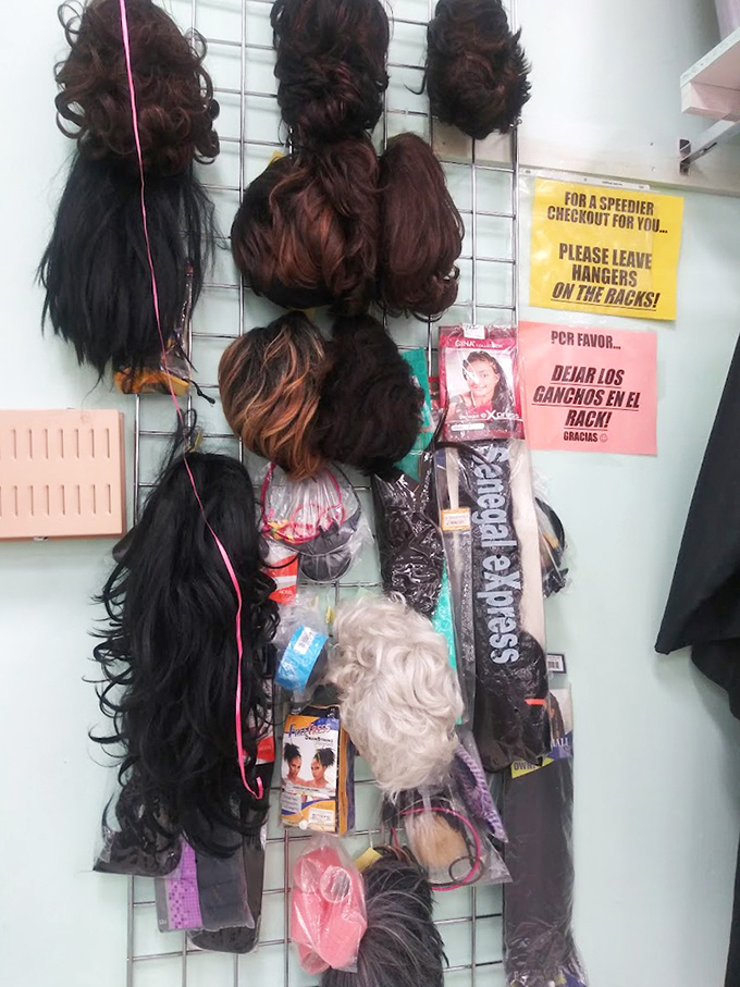 The wig wall: where transformation is just a try-on away. Halloween solutions or bold style statements&mdash;you decide!