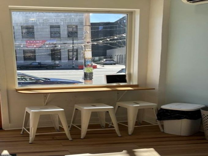 The honeycomb-patterned wall isn't just design&mdash;it's foreshadowing for the sweet experience ahead. Even the tip jar looks optimistic. 