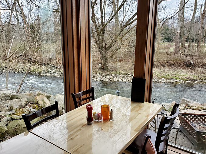 The window seat everyone fights for &ndash; dining with a front-row view of the gentle current of Tinkers Creek.